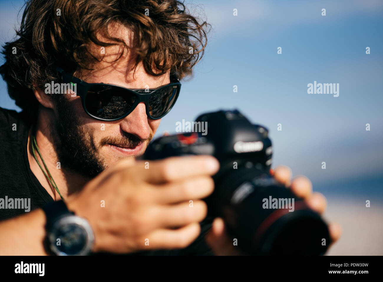 A man walking around nature and taking photos Stock Photo - Alamy