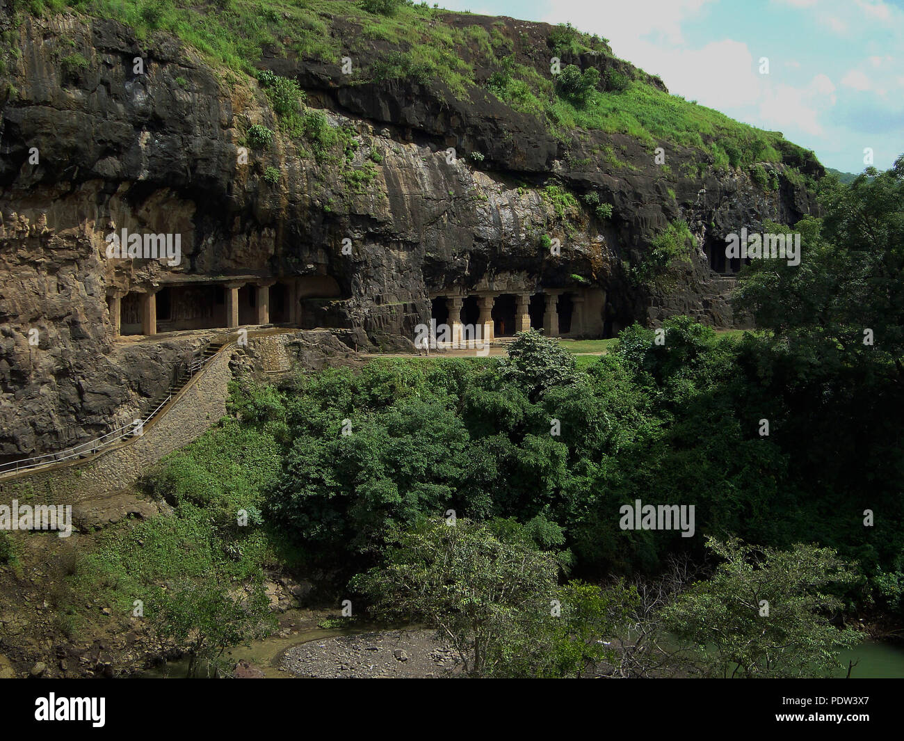 Ancient caves carved into the mountainside in india Stock Photo - Alamy