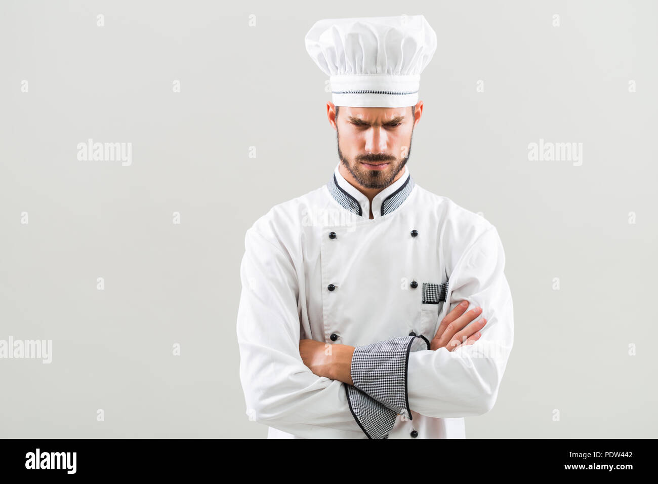 Angry chef on gray background Stock Photo - Alamy