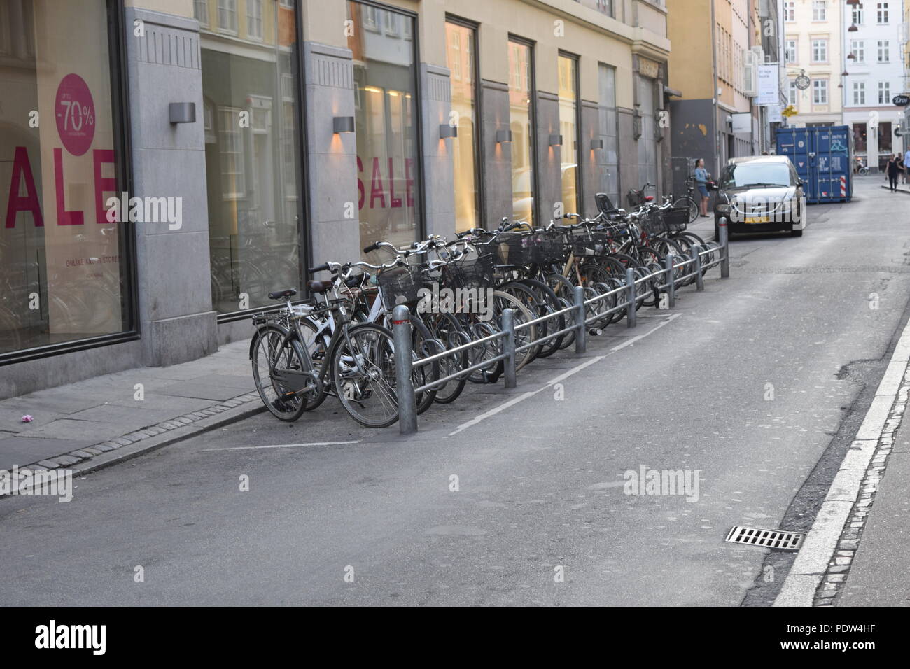 A Row of Bikes parked on the Street in Copenhagen, Denmark Stock Photo ...