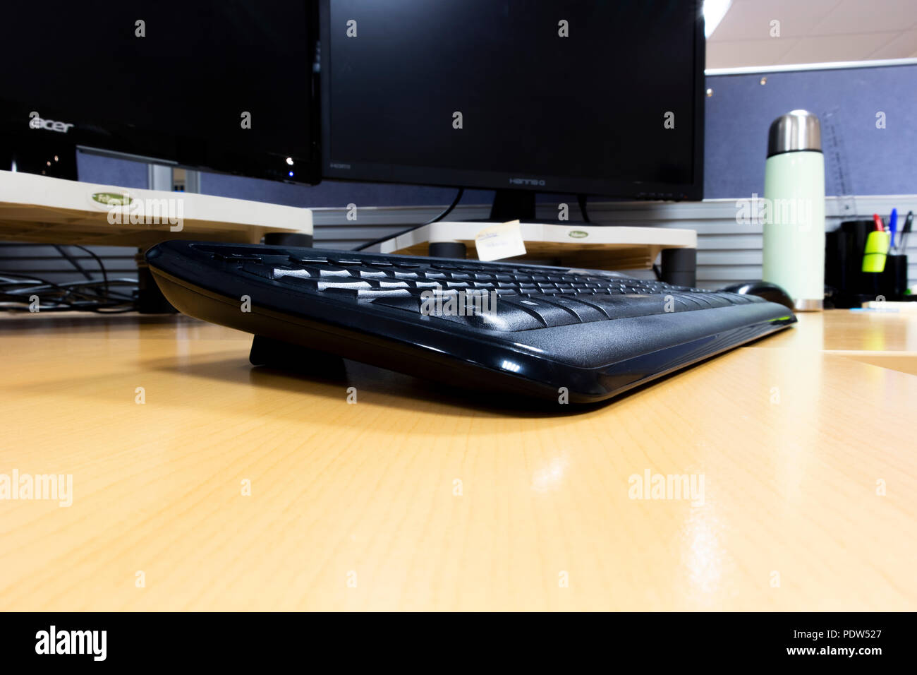 business desk office interior with keyboard to computer workstations ...