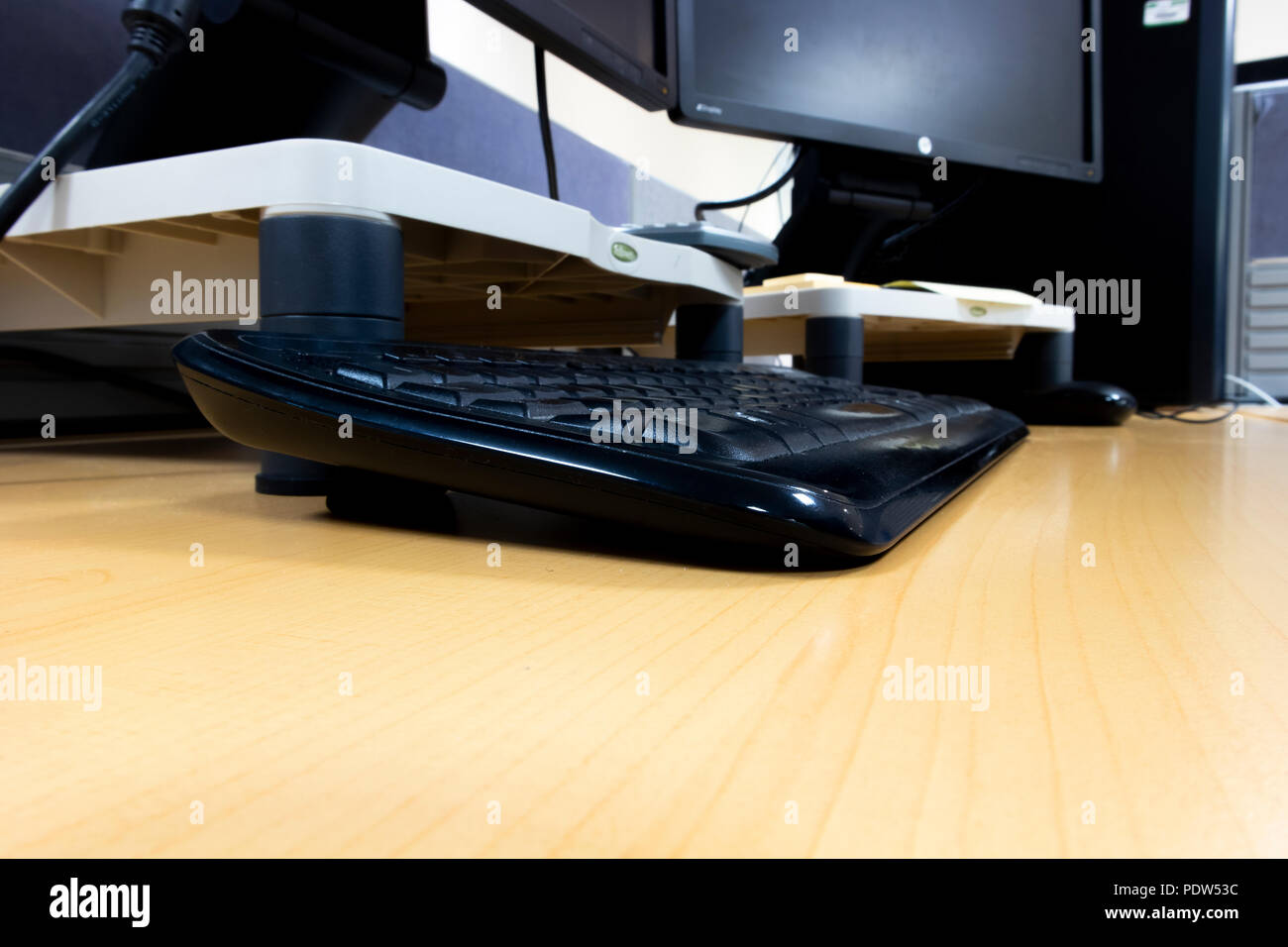 business desk office interior with keyboard to computer workstations ...