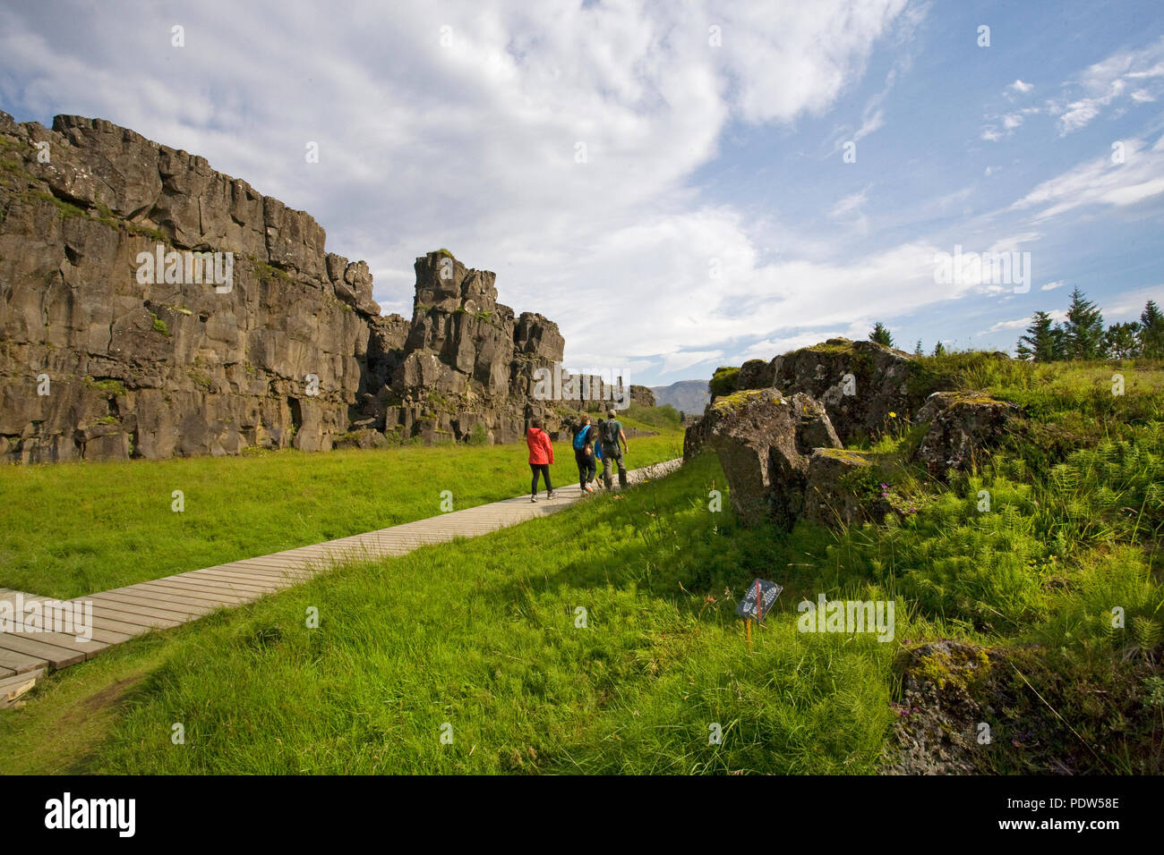 Hikers wander the famous Almannagja Gorge, in Thingvellir National Park ...