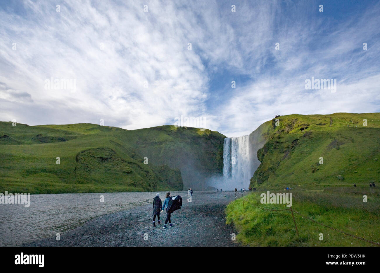 Skogafoss Waterfall, near the village of Skogar, Iceland, is one of ...