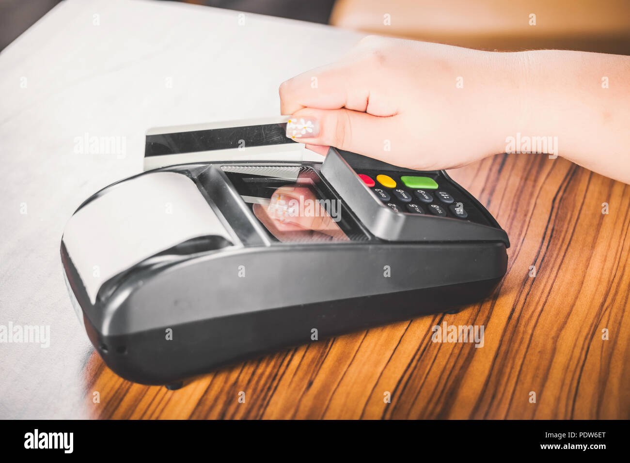 Hand Swiping Credit Card In Store good Stock Photo - Alamy