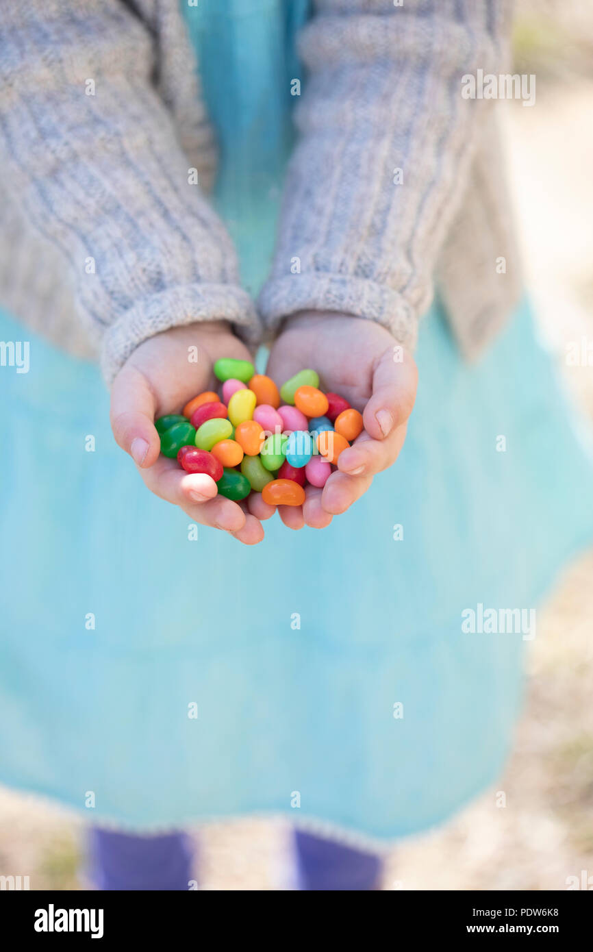 Child holding candy Stock Photo - Alamy