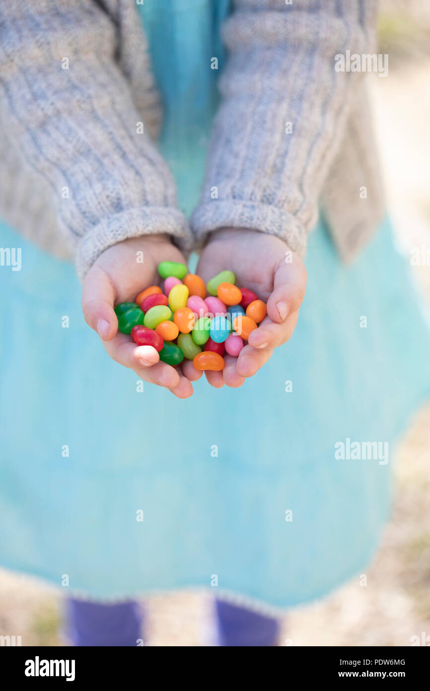 Child holding candy Stock Photo - Alamy