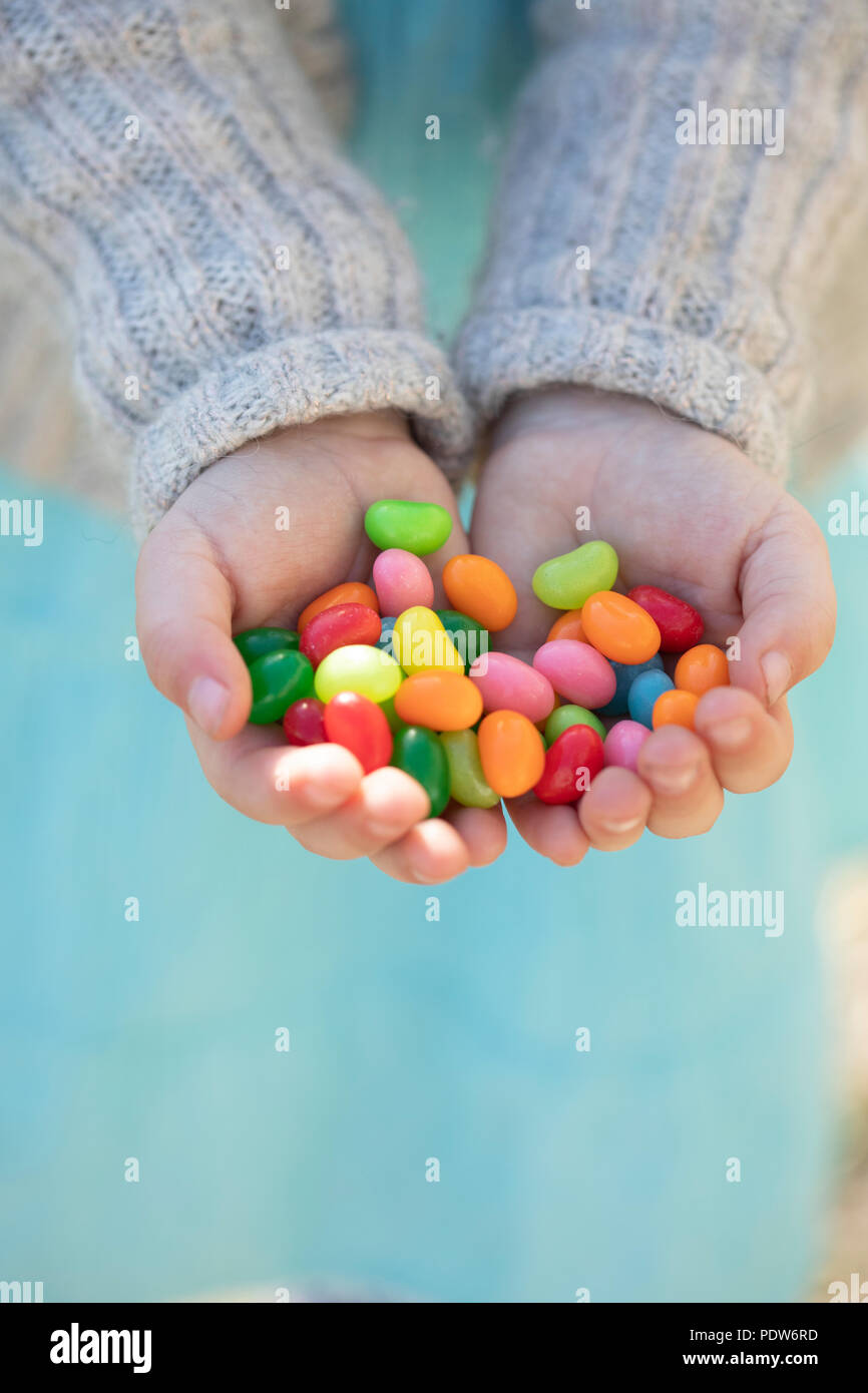 Child holding candy Stock Photo - Alamy