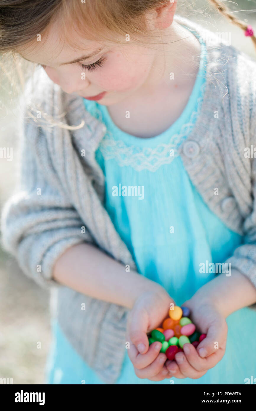 Child holding candy Stock Photo - Alamy