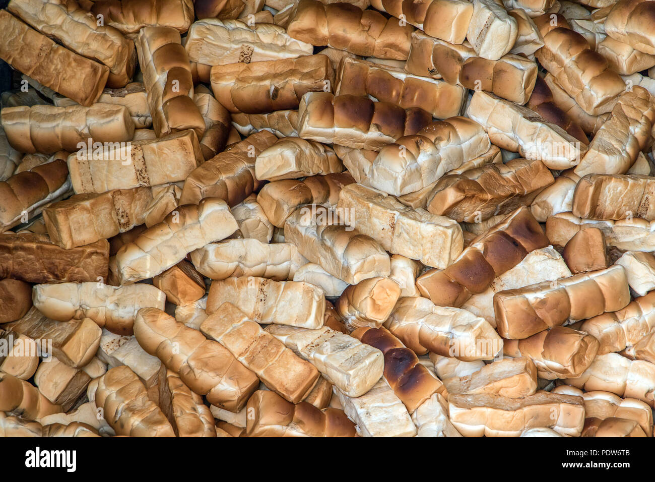 Large heap of pastries. Old pastry on the pile. Bread ready for feeding ...