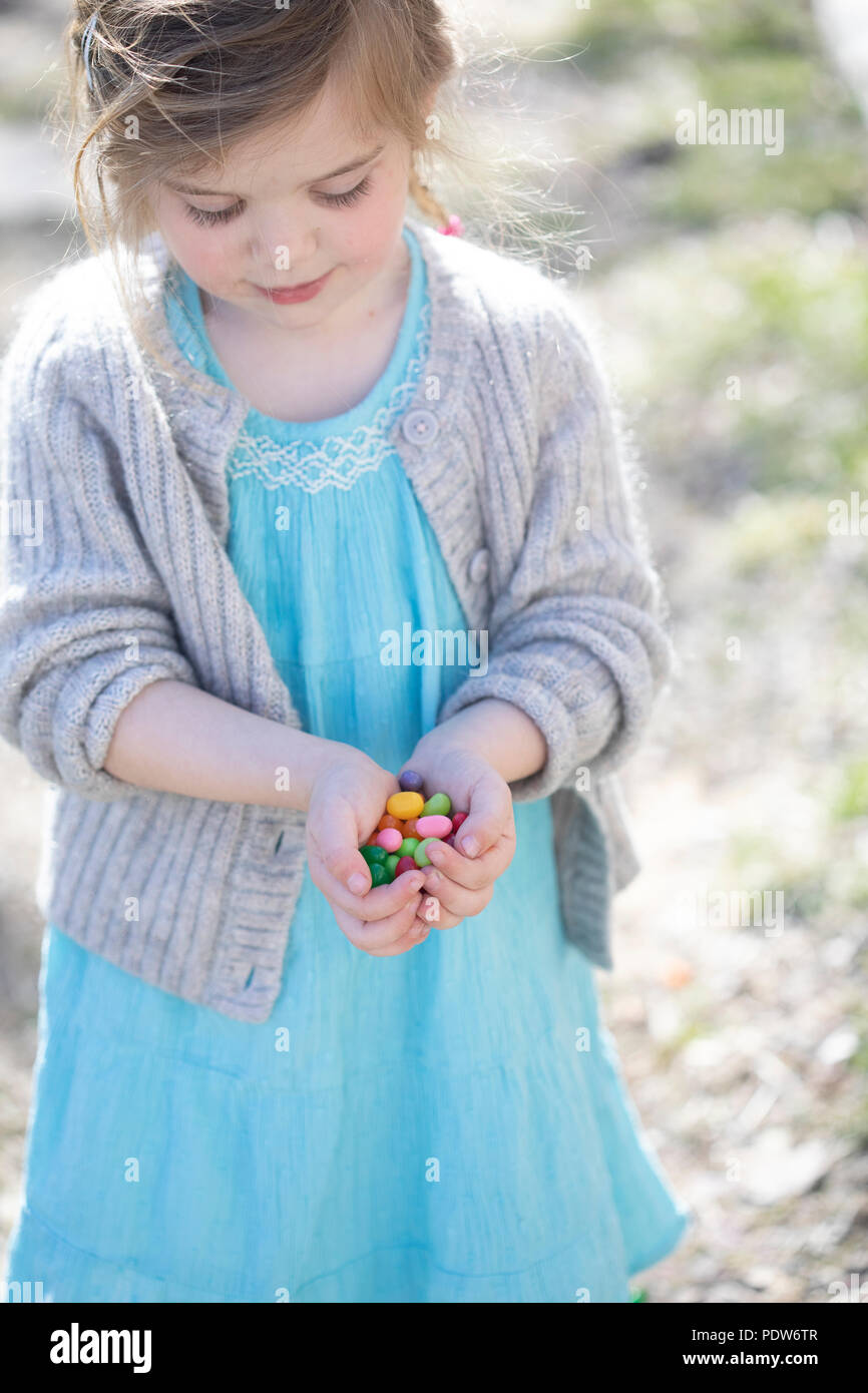 Child holding candy Stock Photo - Alamy