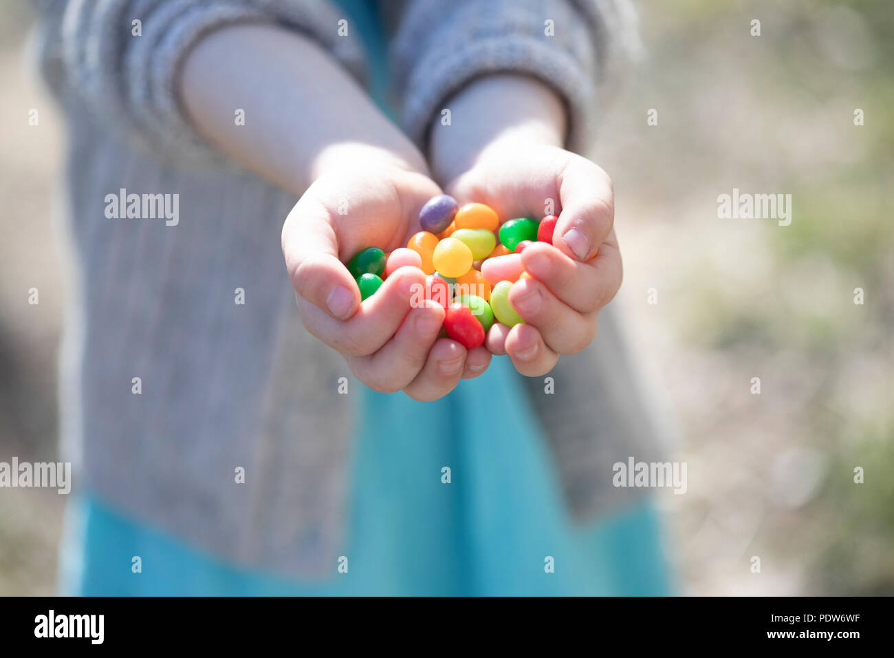 Child holding candy Stock Photo - Alamy