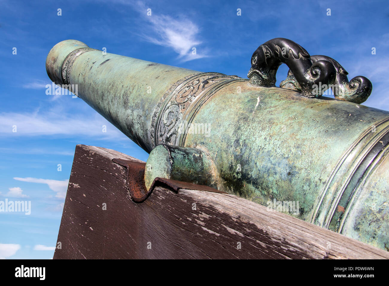 The old large caliber cannon heads to the blue sky. Decorative cannon ...