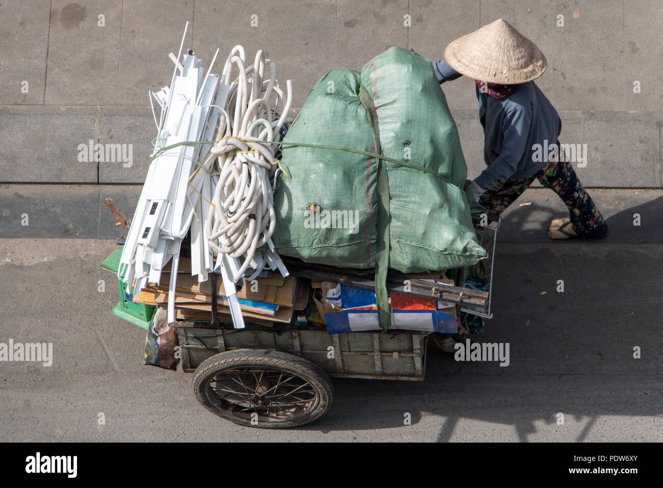 Collection of recyclable waste in the streets of Ho Chi Minh city ...