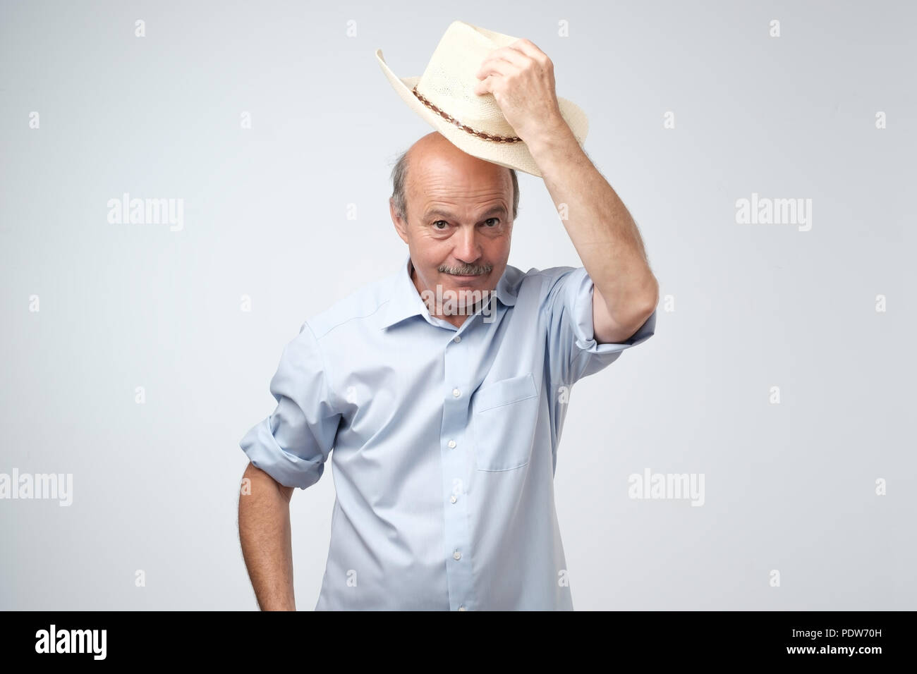 You are welcome concept. Cheerful mature man in blue shirt and cowboy ...