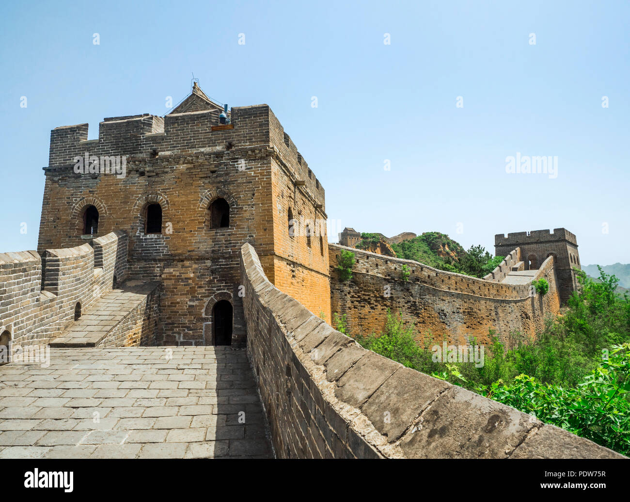 The Great Wall Jinshanling section with green trees in a sunny day ...