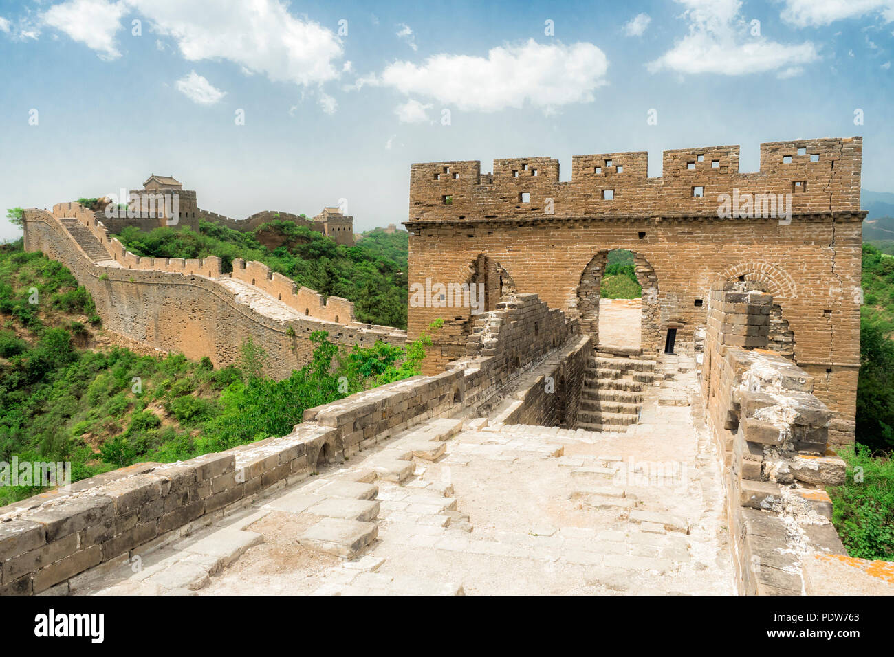 The Great Wall Jinshanling section with green trees in a sunny day ...