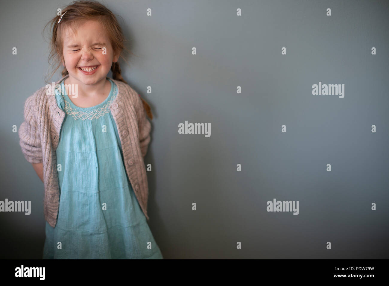 Portrait of a little girl with eyes closed, smiling Stock Photo - Alamy