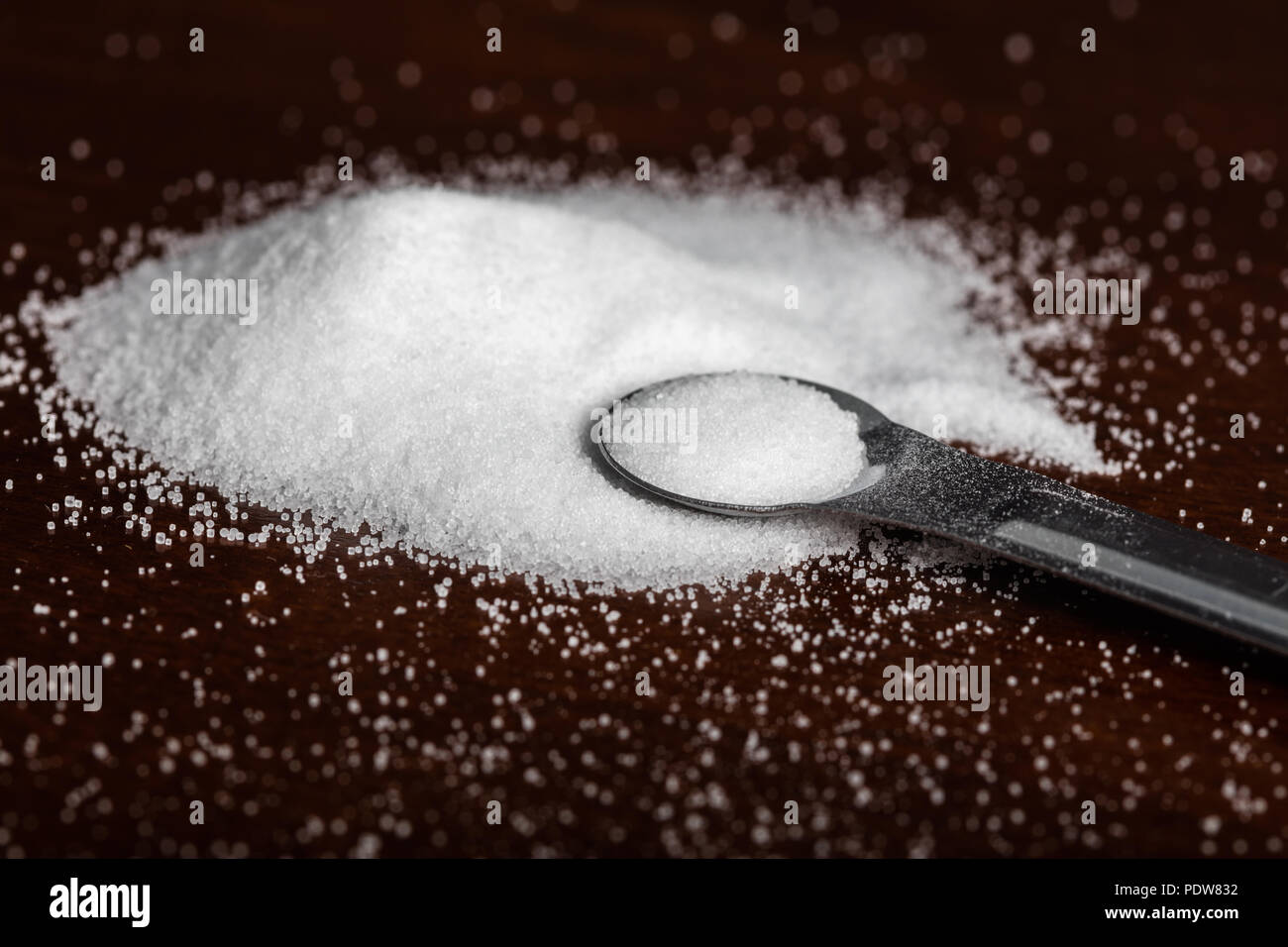table salt with dark background close up shot Stock Photo - Alamy