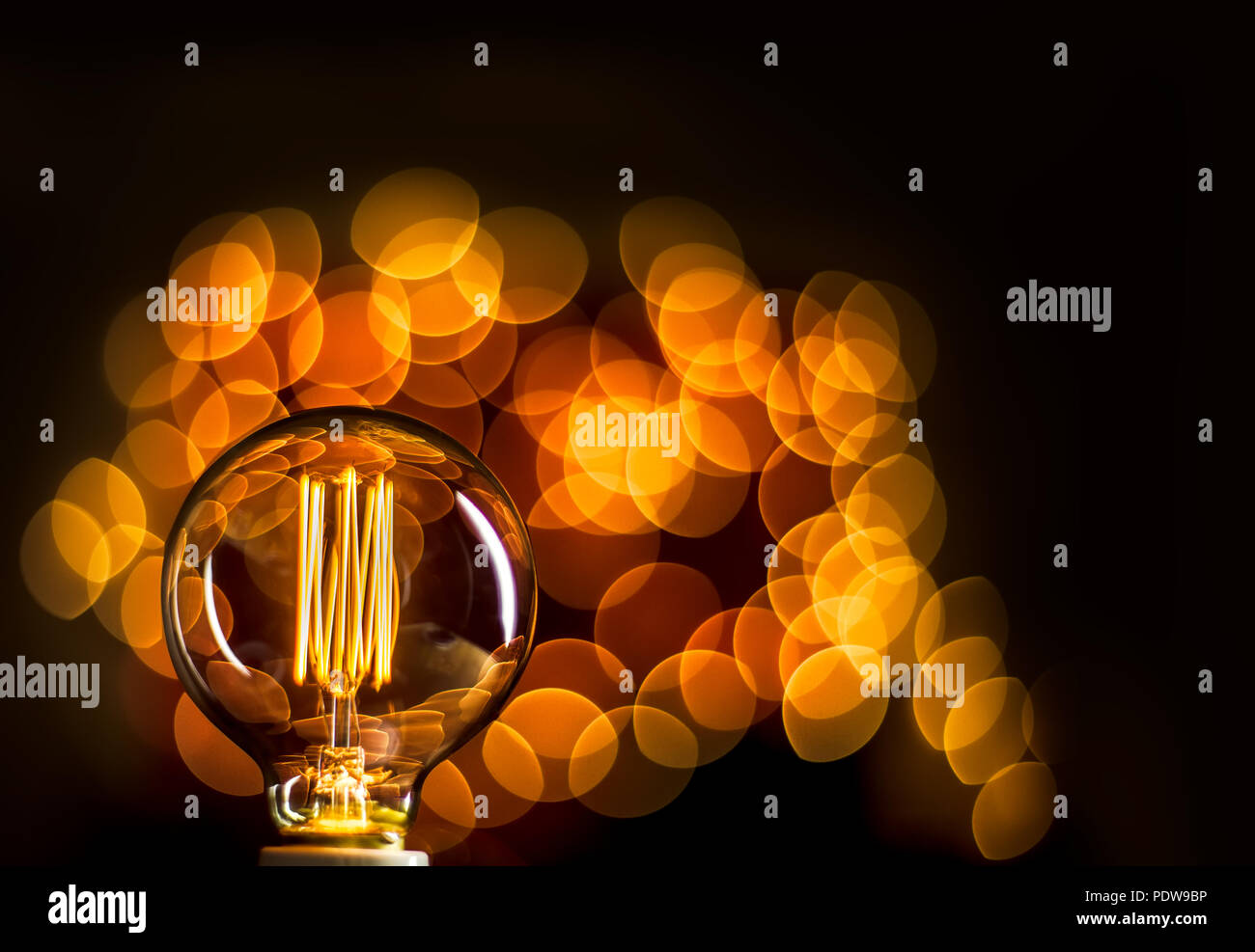 Lighting bulb with beautiful bright bokeh background with copy space ...