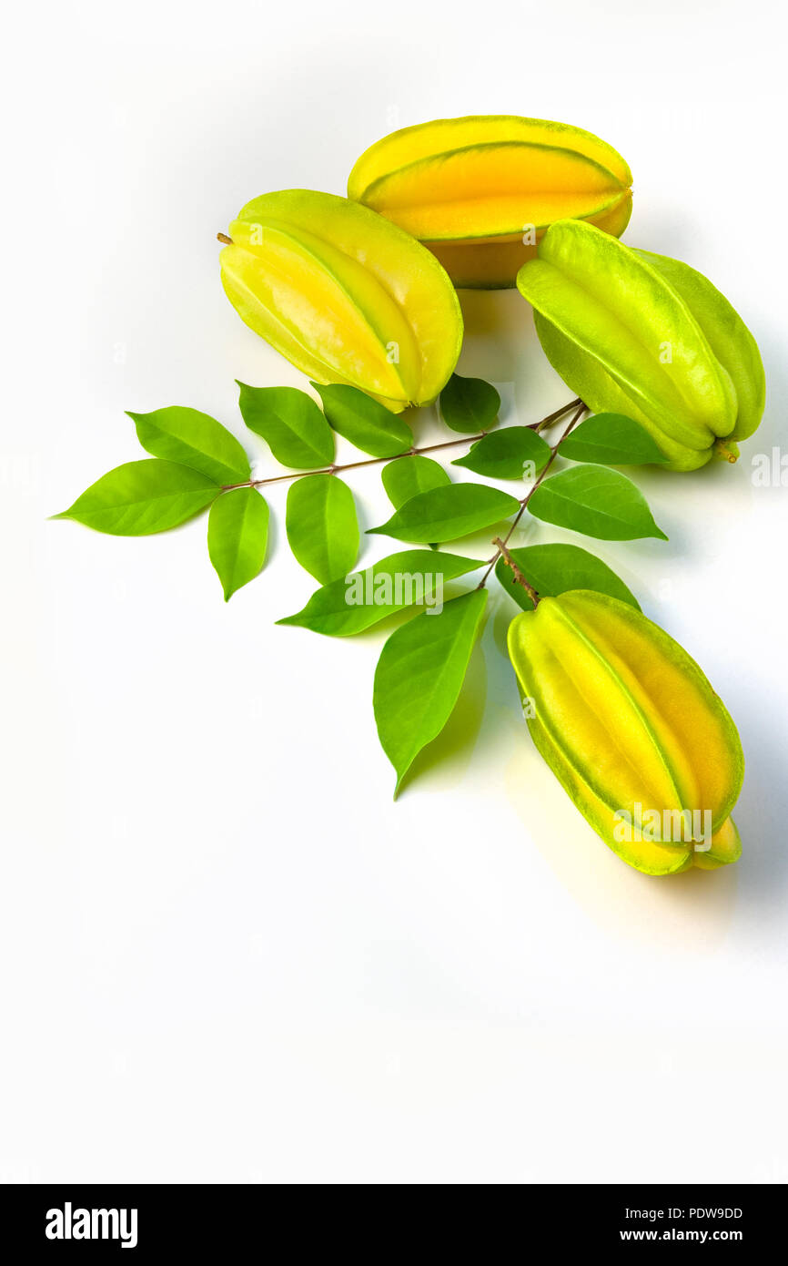 Yellow green star carambola or star apple ( starfruit ) on white ...