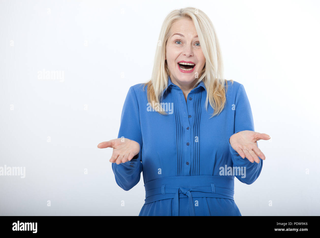 Portrait of happy middle aged woman. Surprised happy woman looking with ...