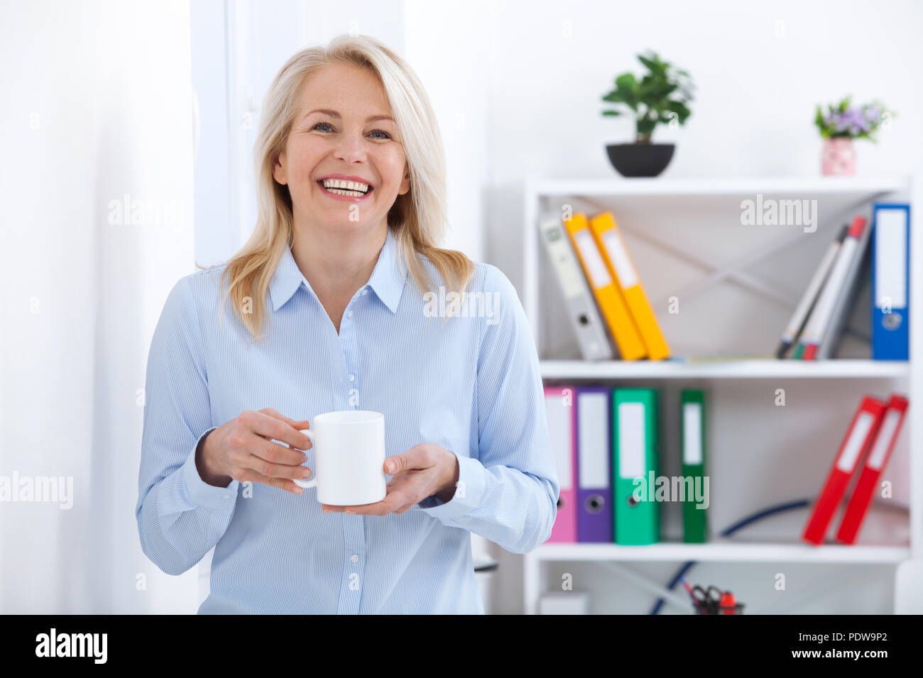 Smiling middle aged businessman hi-res stock photography and images - Alamy