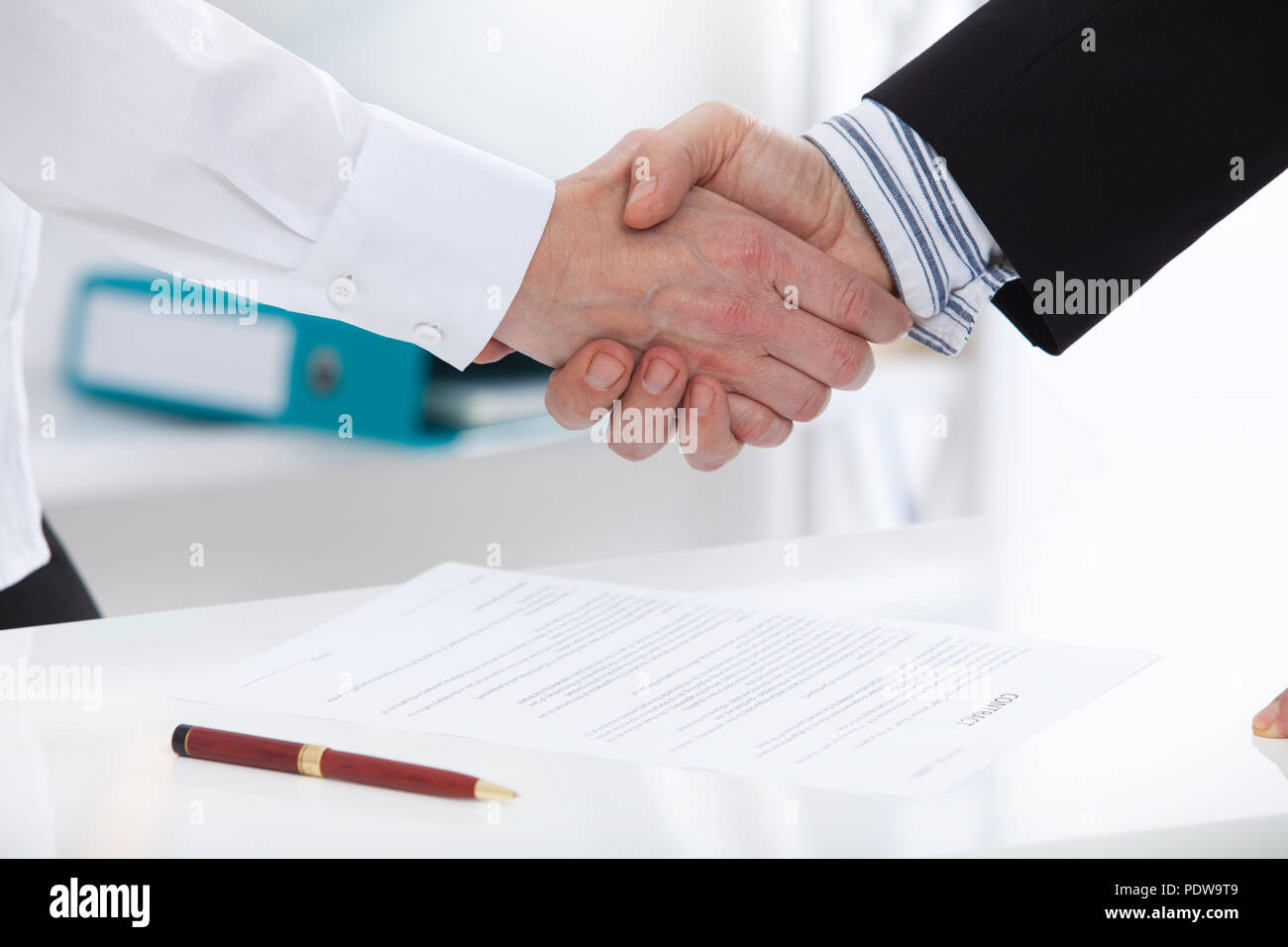 Business woman and man doing a handshake close up. Business people ...