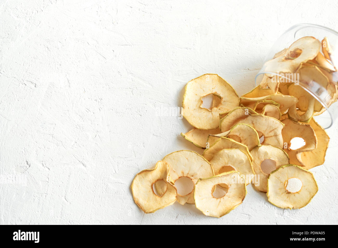Apple dehydrated fruit chips on white background, copy space, healthy ...