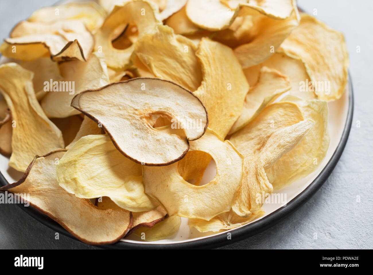 Various fruit chips on white background, copy space. Assorted ...