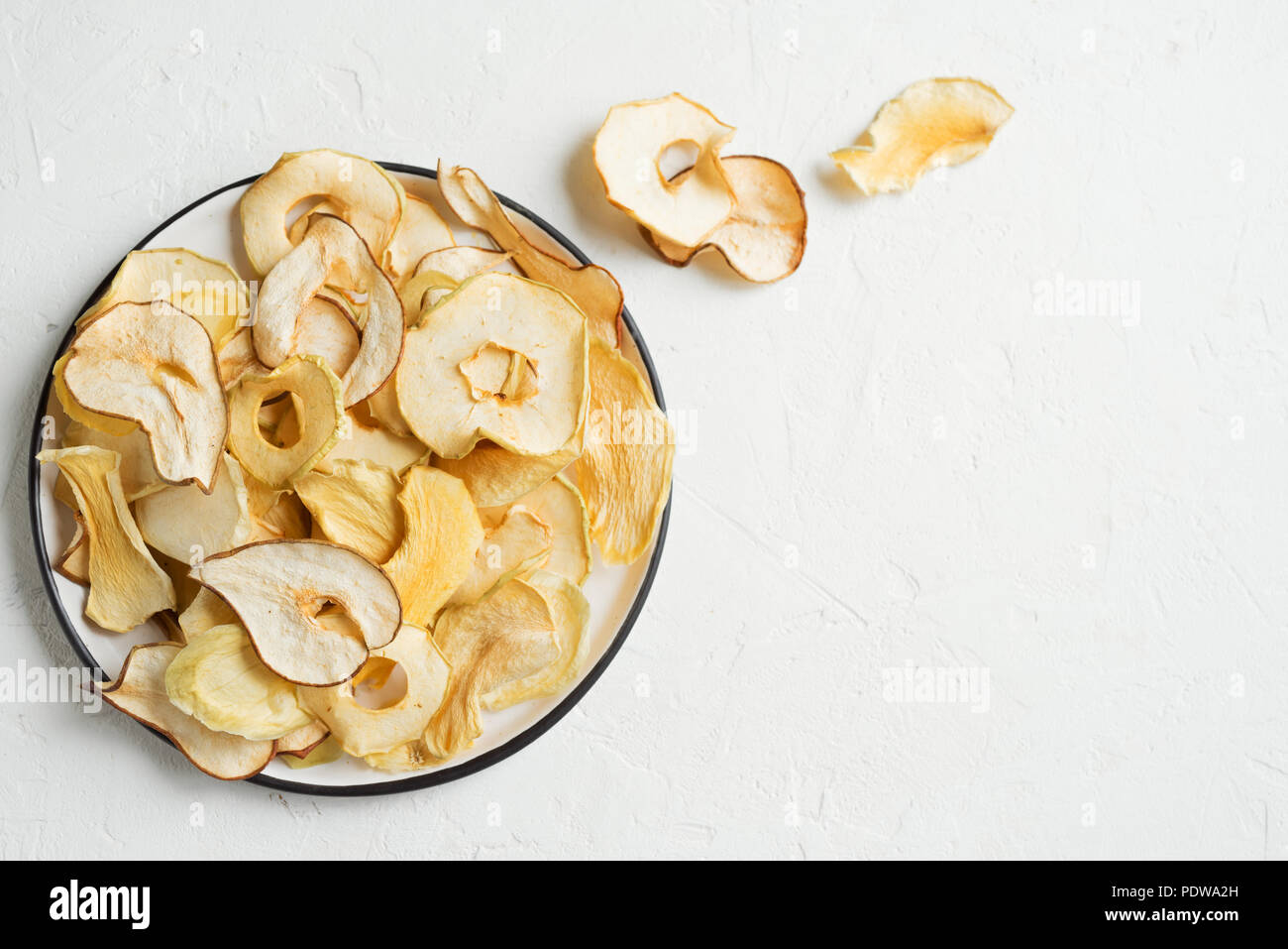 Various fruit chips on white background, copy space. Assorted ...
