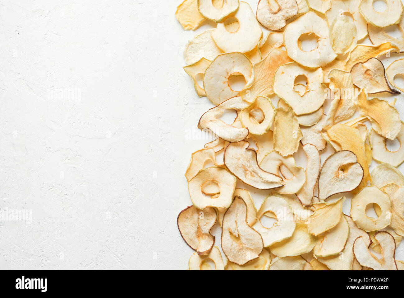 Various fruit chips on white background, copy space. Assorted ...