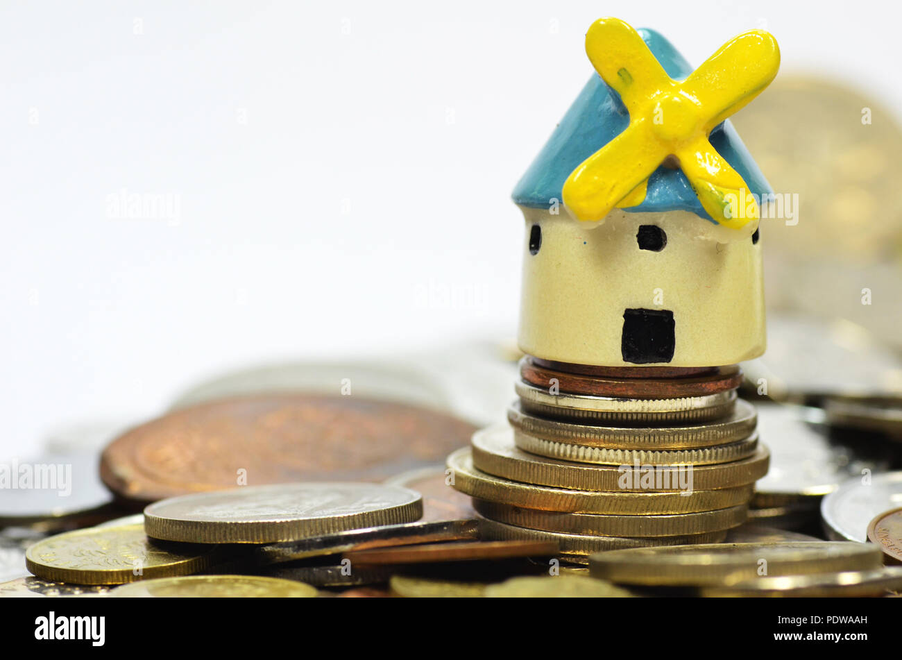 Mortgage concept by money house from coins Stock Photo - Alamy