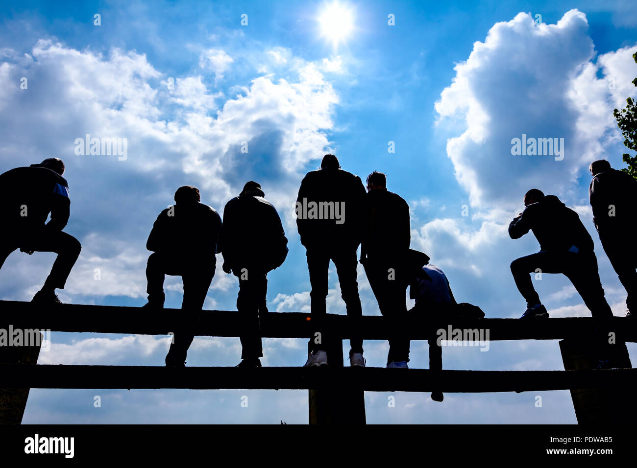 Shadows of audience on dry and dusty race track, bleachers are at open ...
