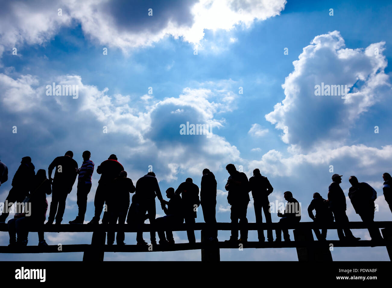 Shadows of audience on dry and dusty race track, bleachers are at open ...