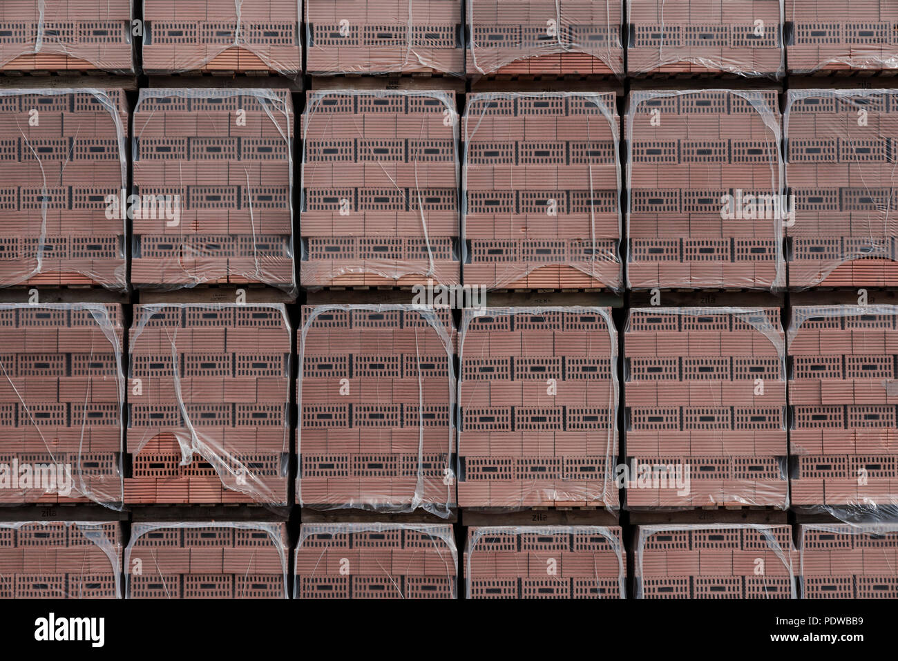red building bricks in stacks and rows on top of each other Stock Photo ...