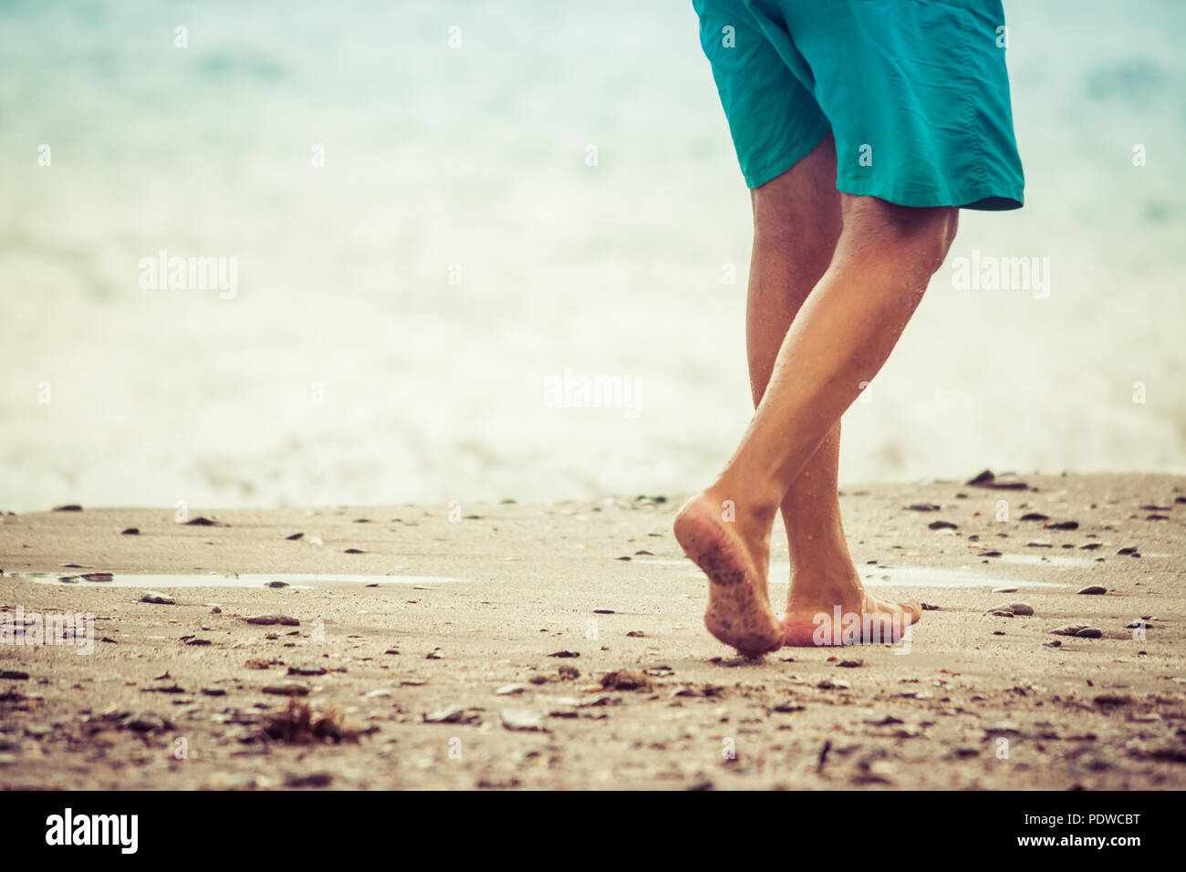 Closeup of legs and feet walking on the beach Stock Photo - Alamy