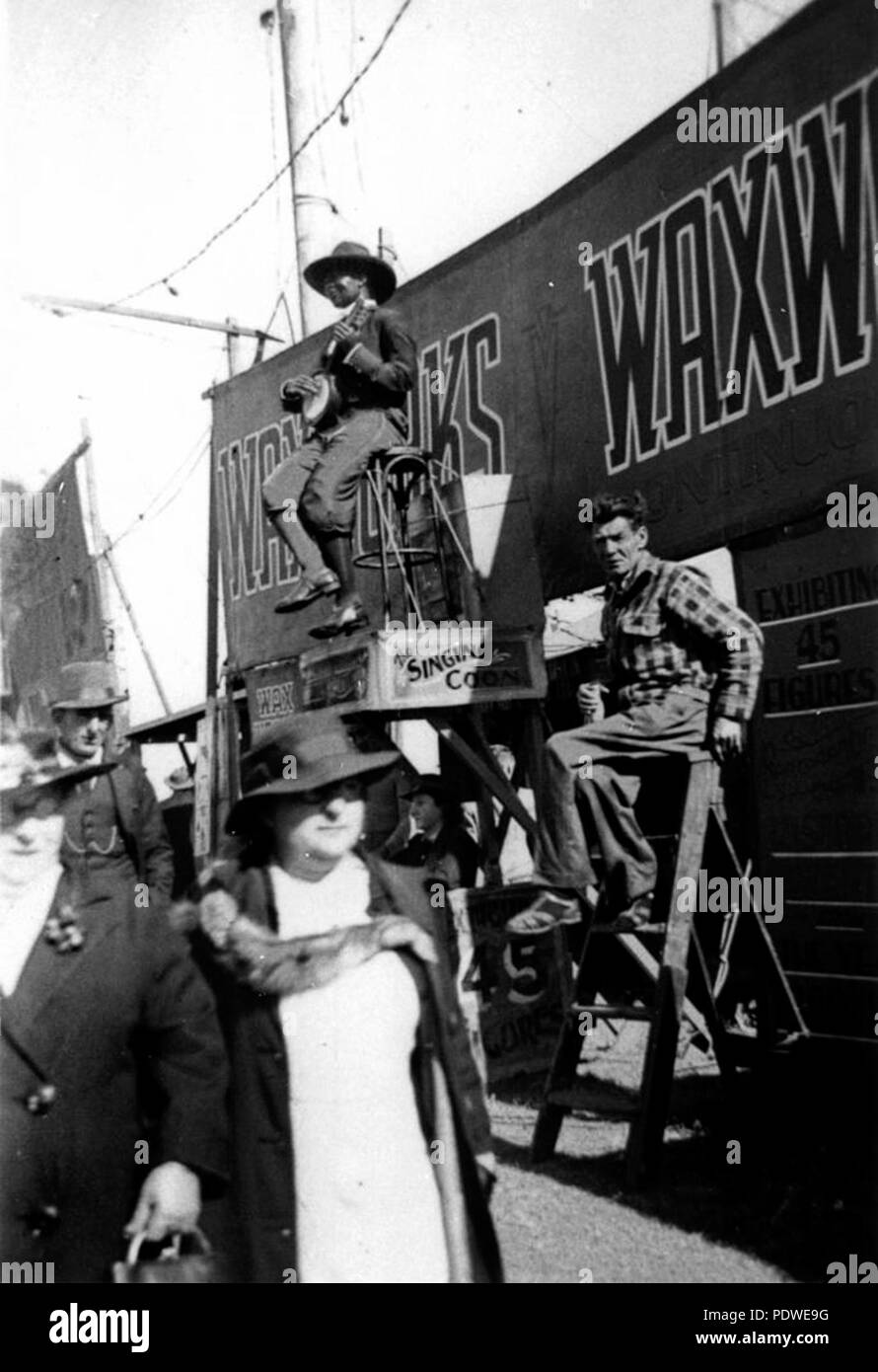 216 StateLibQld 1 128823 Sideshow Alley advertising, Exhibition Ground ...