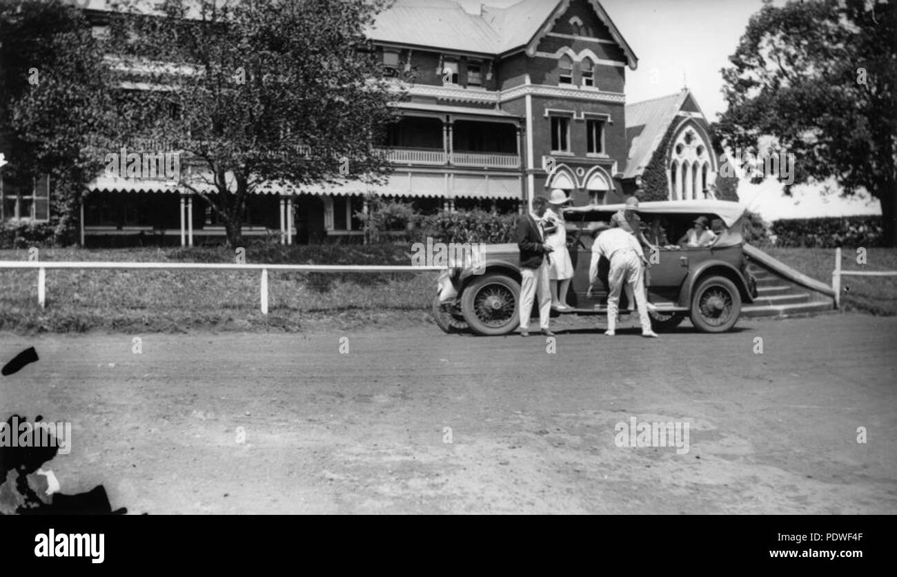 222 StateLibQld 1 139867 Touring car in front of Toowoomba Grammar ...