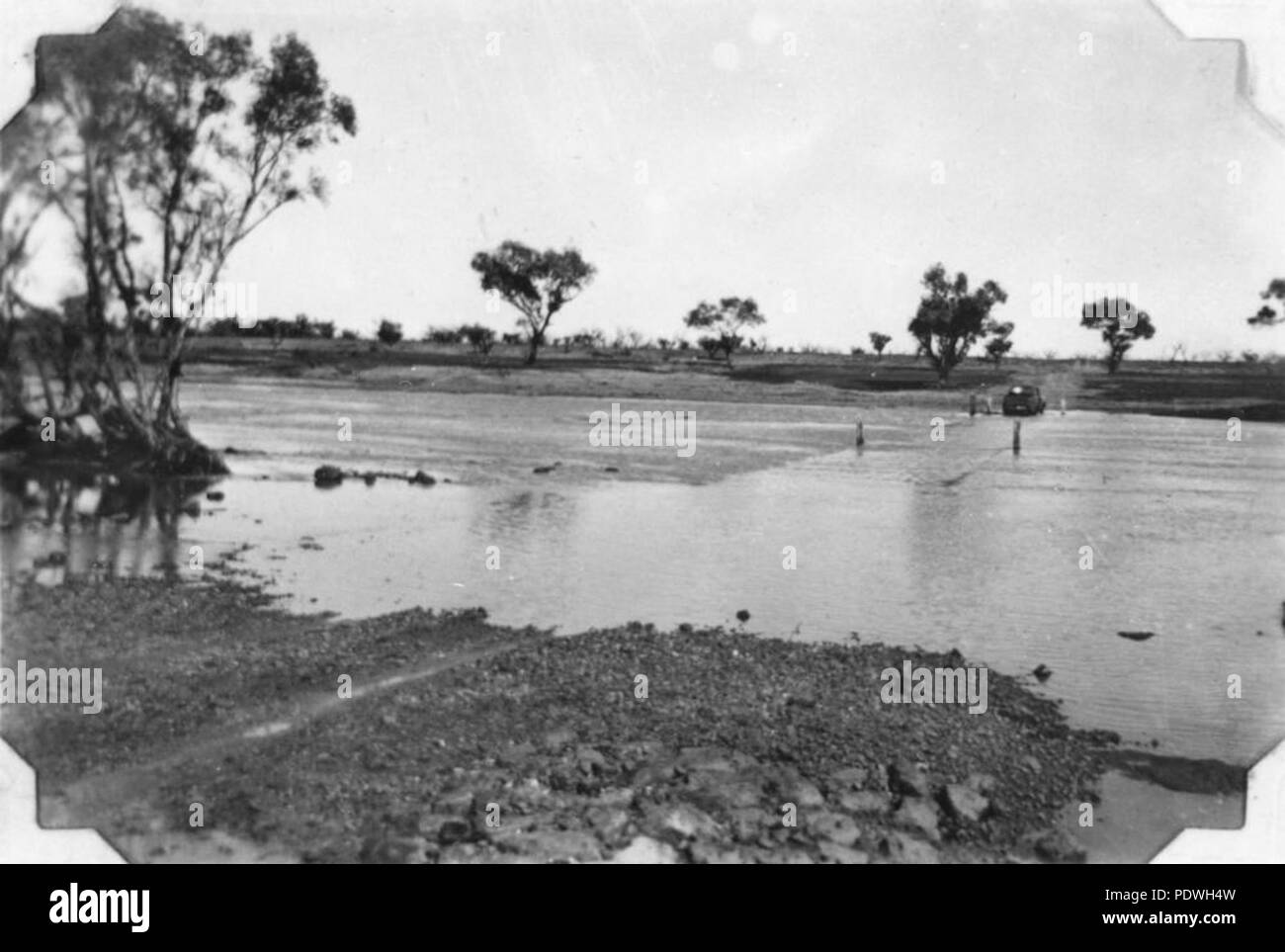 236 StateLibQld 1 161987 Vehicle at the Six Mile Crossing during floods ...
