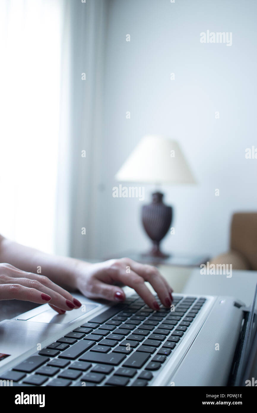 Secretary typist typing on laptop pc computer keyboard keys with hands ...