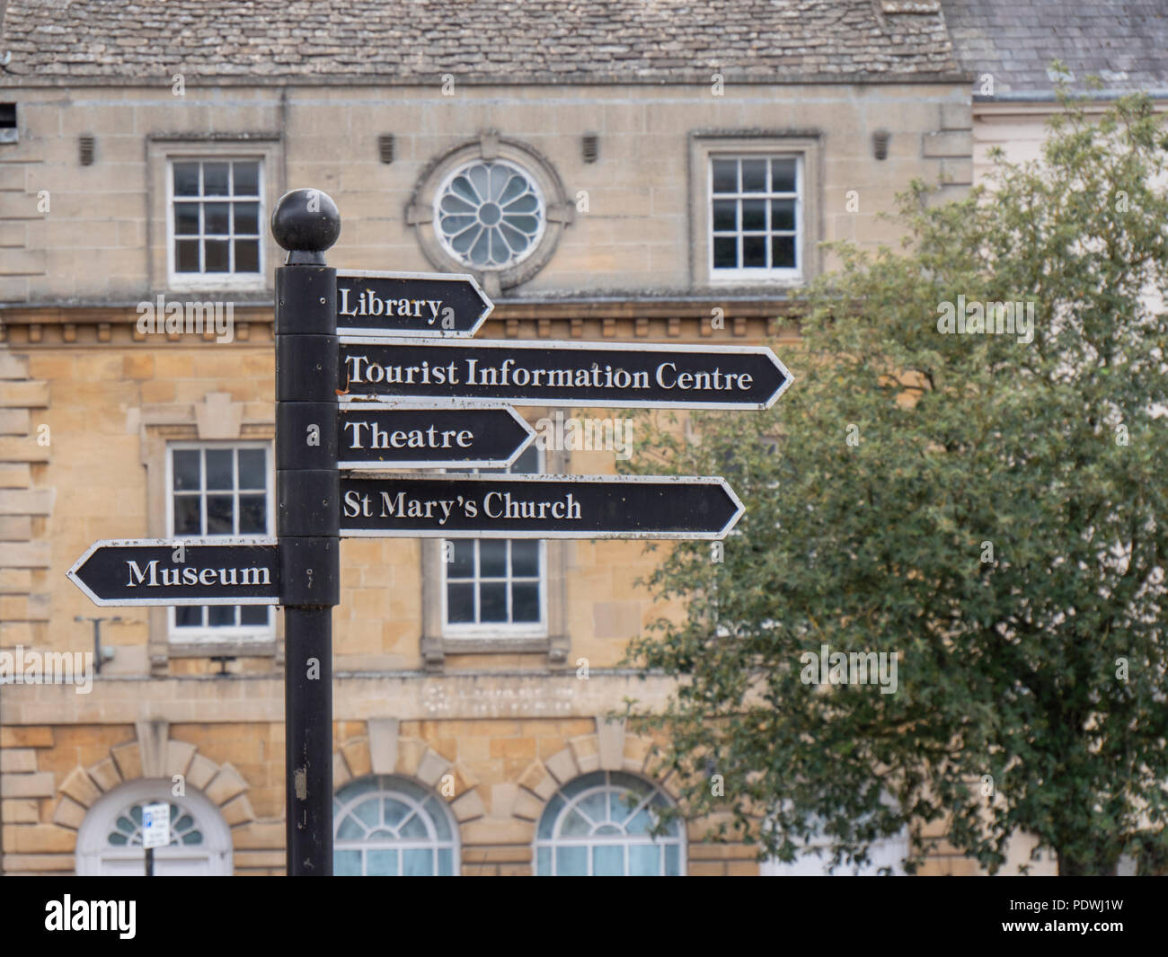 A sign post in a street in the Cotswold town of Chipping Norton ...