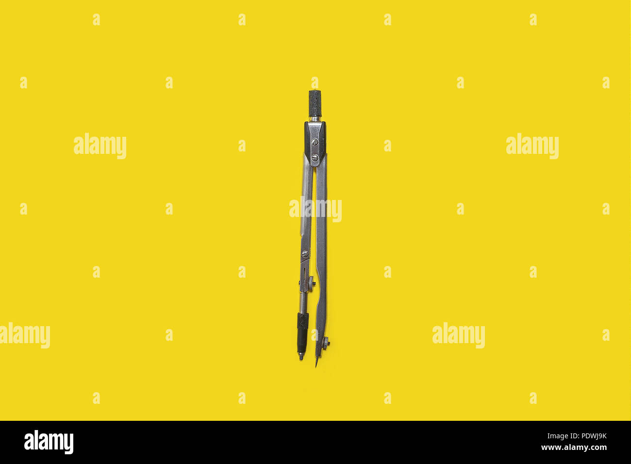 calipers on a yellow background Stock Photo - Alamy