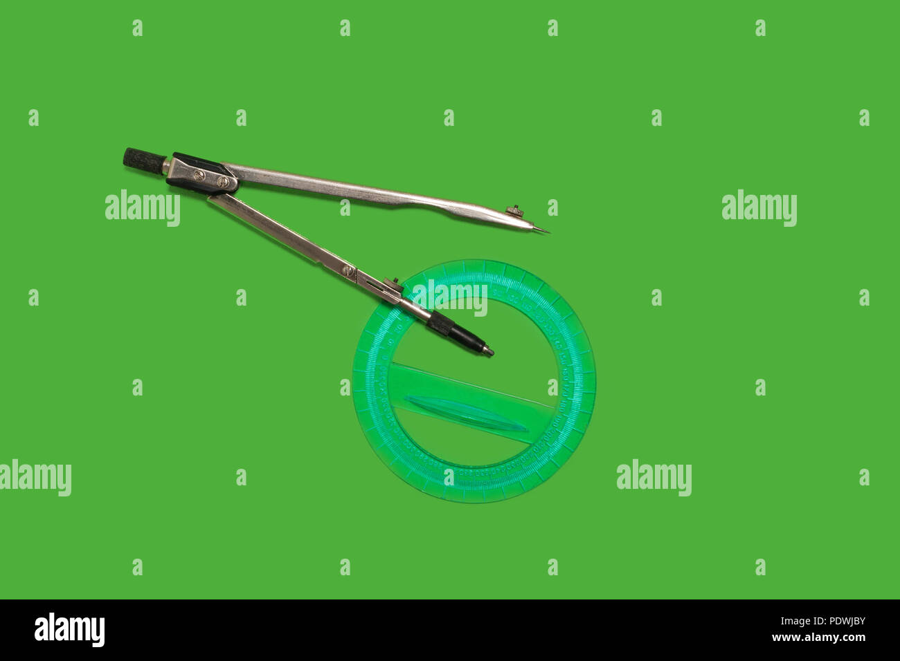 calipers and a ruler on a green background Stock Photo - Alamy