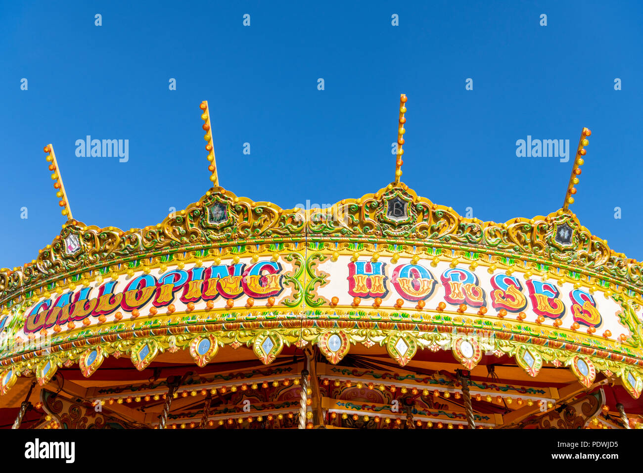 A close up of a coourful galloping horses carousel or roundabout at a ...