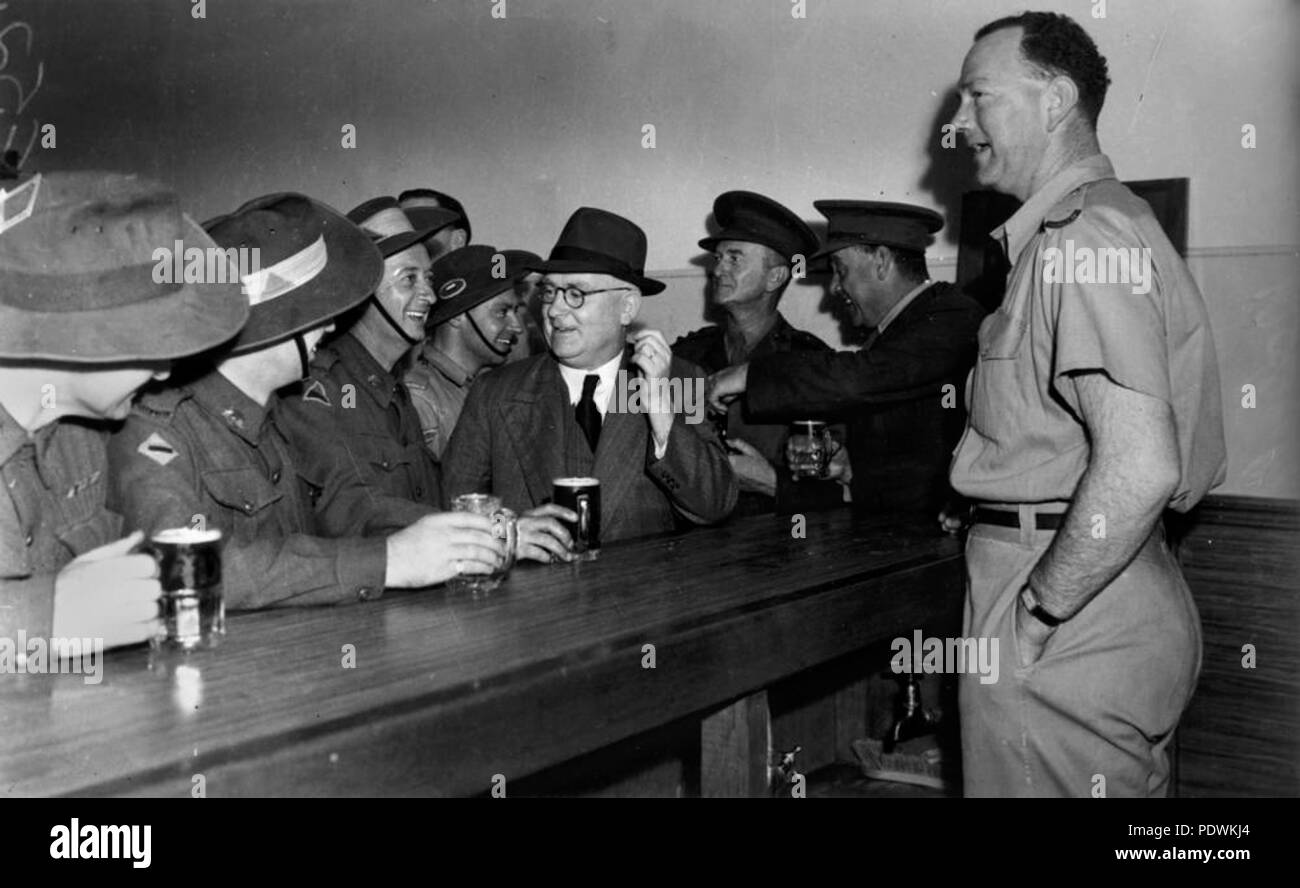 251 StateLibQld 1 210446 Soldiers having a drink at the Army Service ...
