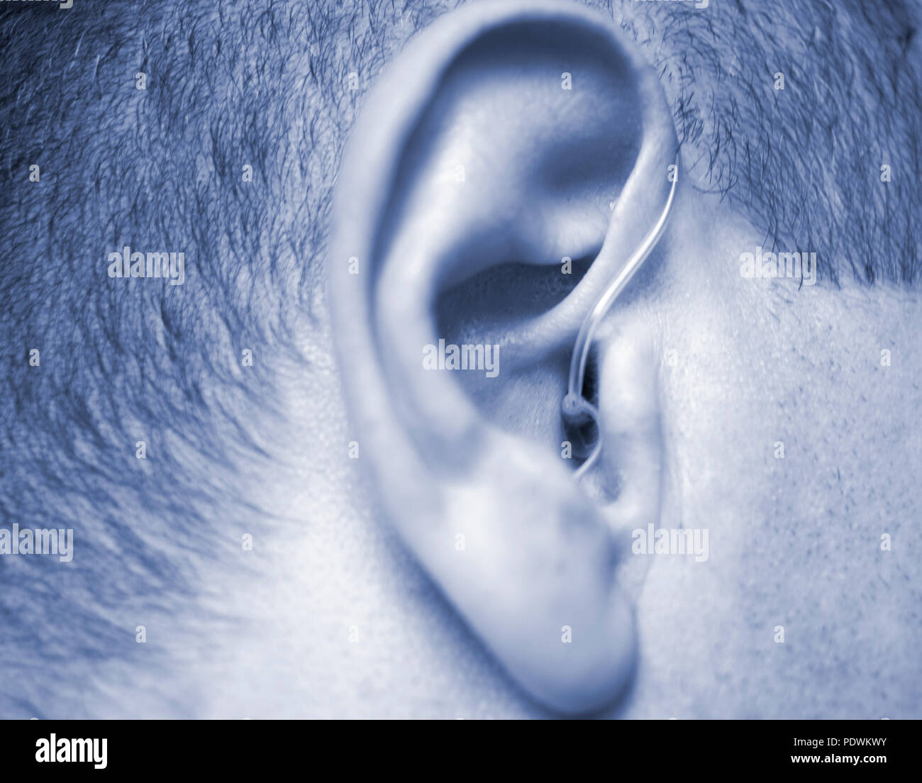 Modern compact in the ear digital audiophone hearing aid in the ear of ...