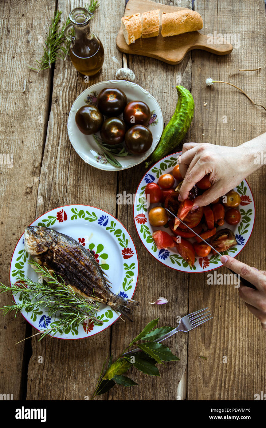 Healthy food. Chef is preparing vegetables salad Stock Photo - Alamy