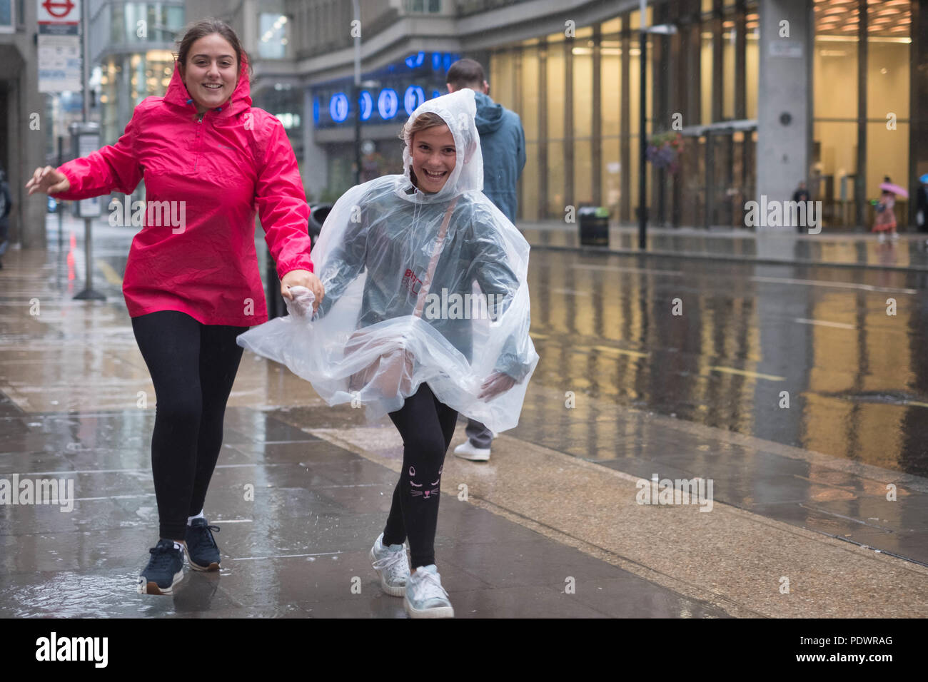 Girls caught in the rain hi-res stock photography and images - Alamy