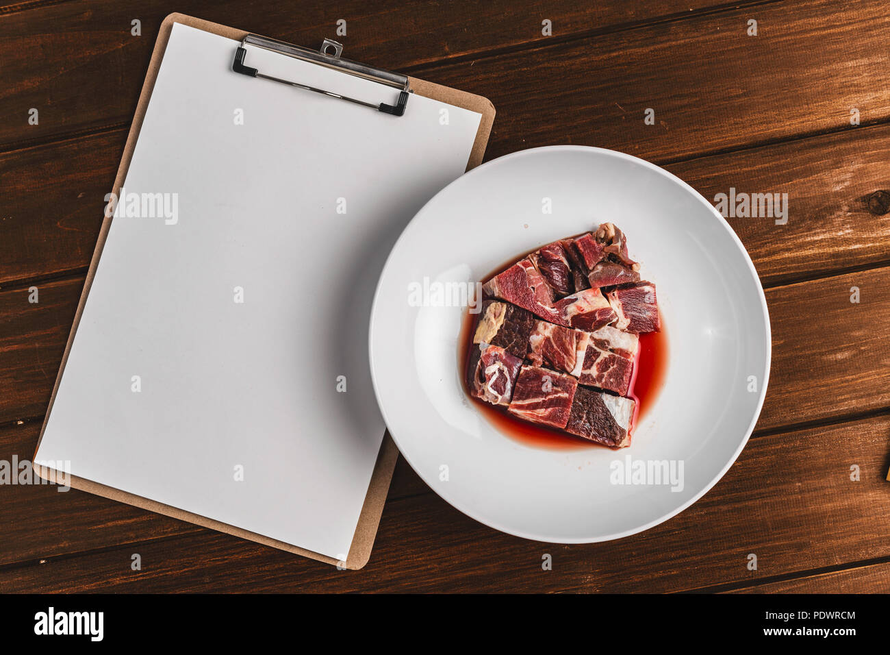 Raw beef and Clipboard nice photo Stock Photo - Alamy